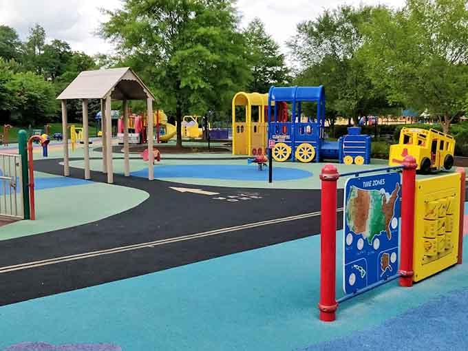 Trains, sensory panels, and rainbow surfaces create a wonderland that puts your childhood playground to shame, honestly.