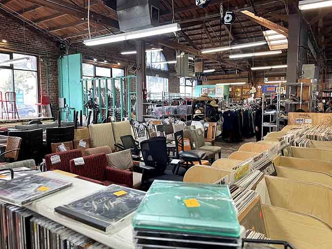 Exposed beams and natural light transform this warehouse into an organized treasure hunt spanning furniture, records, and endless possibilities.