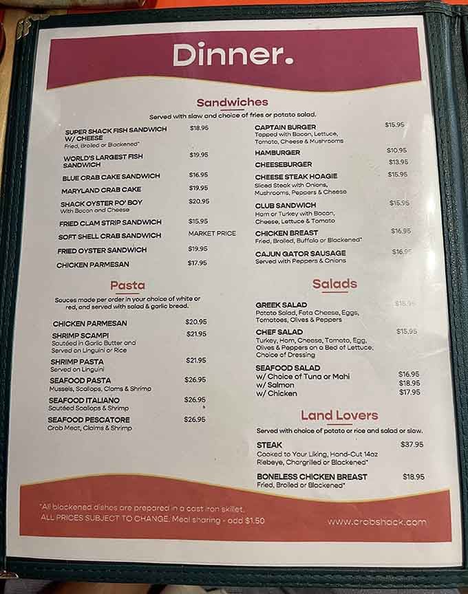 The menu promises everything from shrimp scampi to blue crab cake sandwiches, each item a coastal treasure.