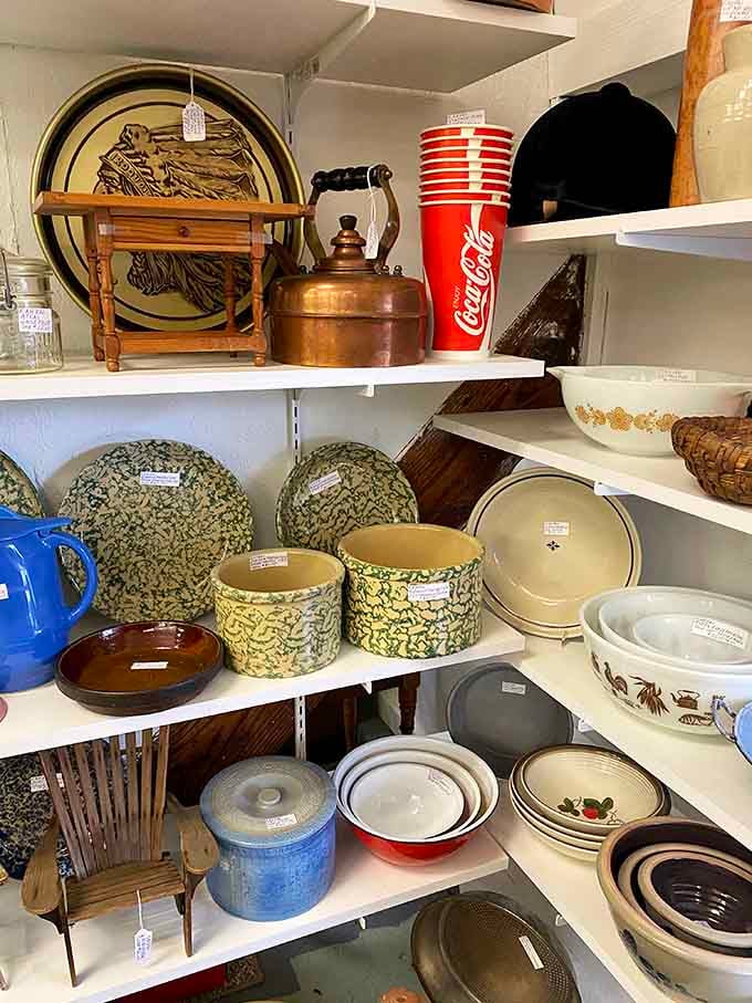 Vintage kitchenware stacked like edible archaeology, where every bowl and pitcher tells a story about someone's Sunday dinners.