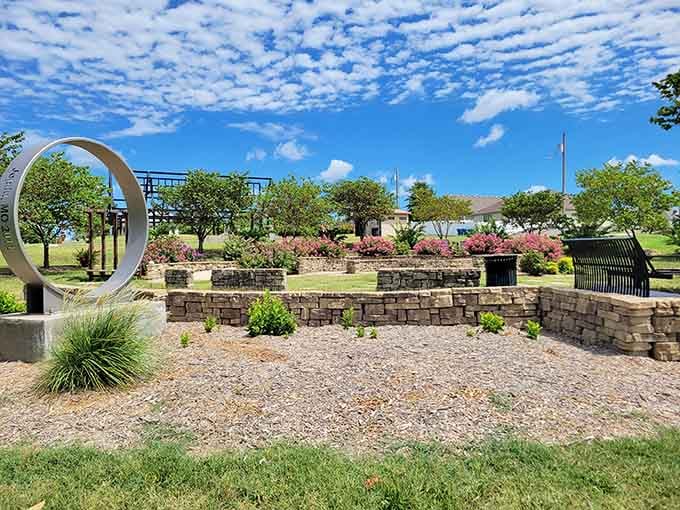 Cunningham Park's tranquil gardens rose from tragedy, featuring thoughtful stonework and contemplative spaces that speak volumes without saying a word.