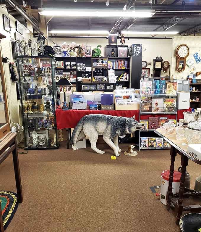A life-sized wolf guards the treasures within, proving that antique malls have the best security systems.