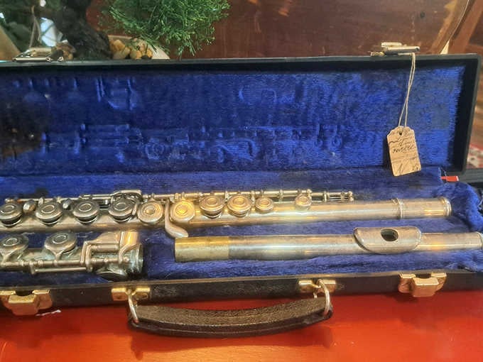 Someone's musical journey paused in time. This vintage flute in its royal blue case waits patiently for its next serenade.