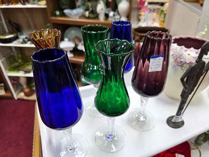 Colored glass that catches light like bottled sunshine, making your grandmother's collection look downright amateur.