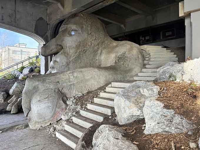 From this angle, you can truly appreciate the massive scale of this bridge-dwelling behemoth and his prize.