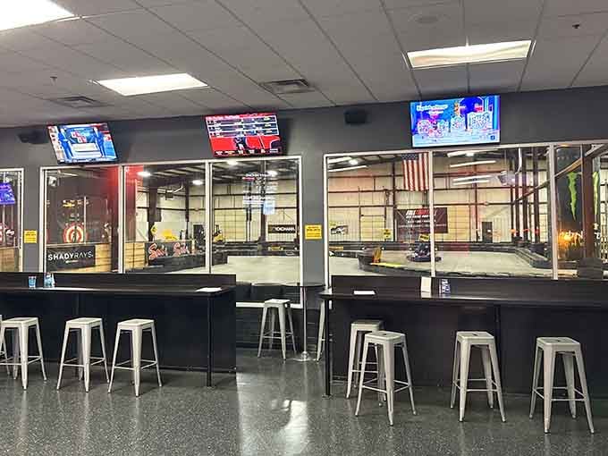 Those viewing windows let spectators watch the action unfold while enjoying refreshments, like a pit crew with better snacks.