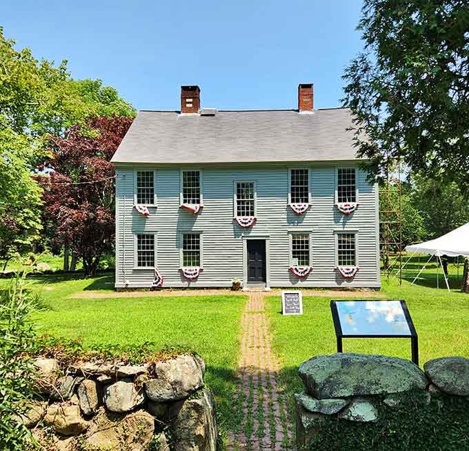 The General Nathanael Greene Homestead stands as proudly today as its Revolutionary War hero owner once did, complete with patriotic bunting.