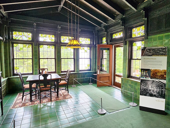 The breakfast room's green tile work creates a garden sanctuary that makes your kitchen nook feel deeply inadequate.