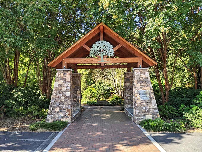 Hatcher Garden's wooden entrance beckons like a portal to affordable serenity. Nature therapy that doesn't require insurance approval or a co-pay.