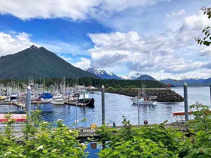 Sitka's harbor sparkles like nature's jewelry box, with boats bobbing against a backdrop of mountains that seem to rise straight from the sea.