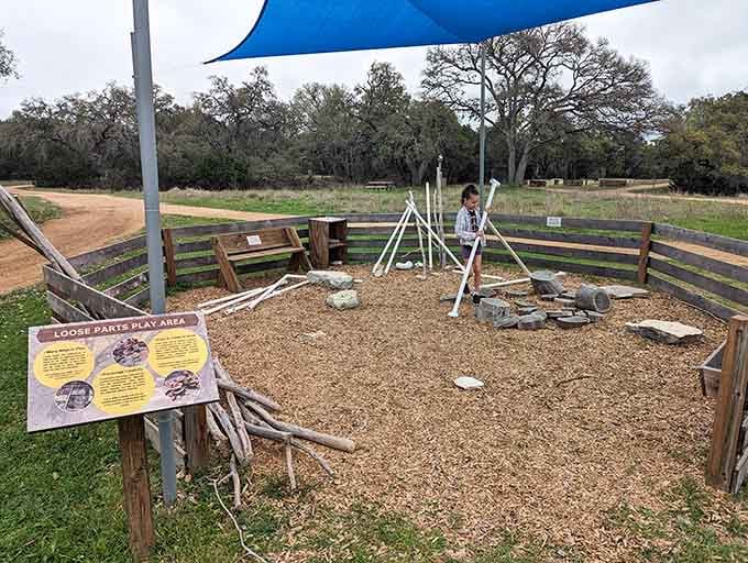 Even the play area gets Hill Country charm, because why should adults have all the scenic fun?