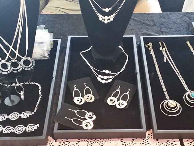 Jewelry cases glimmer with possibilities, from costume pieces to vintage silver. Someone's grandmother once wore these earrings to a special occasion.