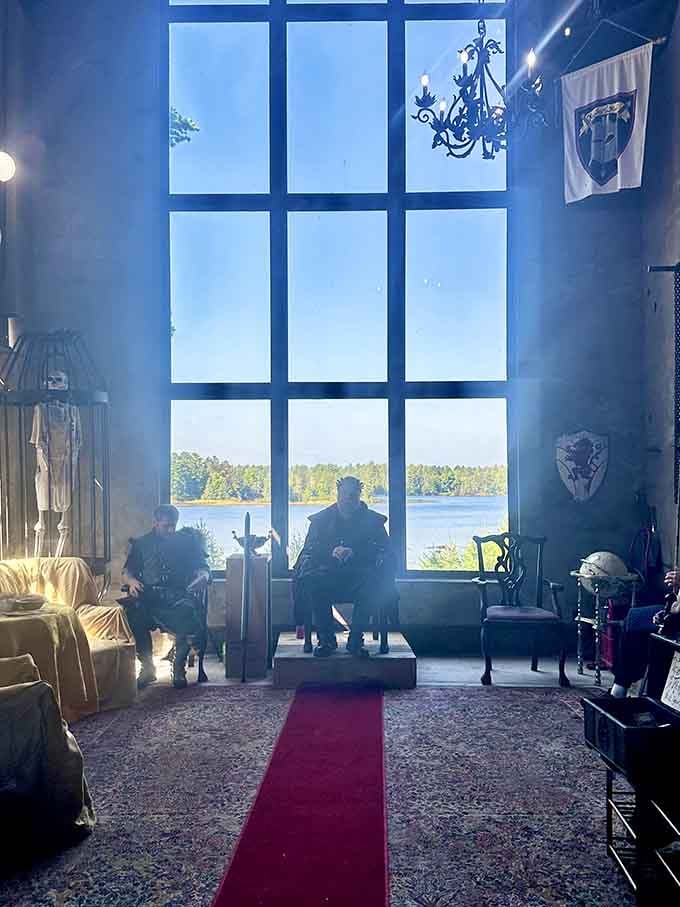 When visitors commit to the castle experience, they really commit, complete with period-appropriate attire and dramatic lakeside poses.