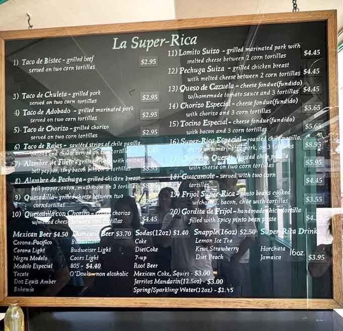 This handwritten menu board is your roadmap to happiness, featuring tacos, quesadillas, and pure Mexican authenticity.