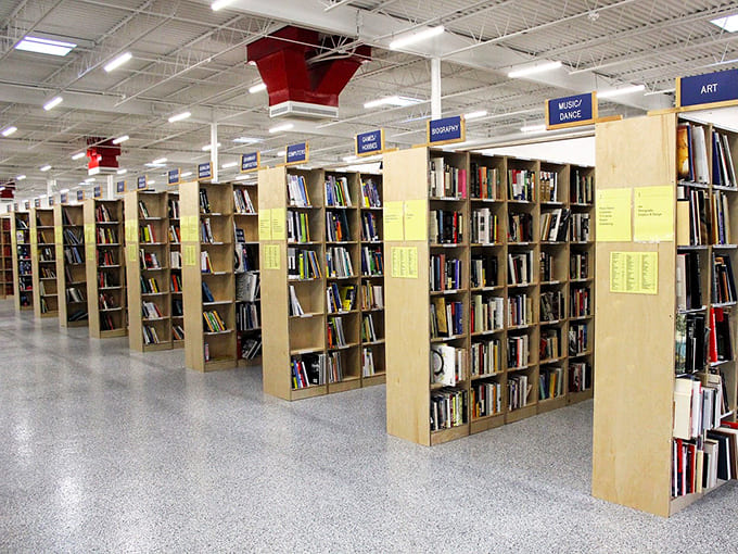 These organized shelves stretch endlessly, like a literary labyrinth designed specifically to make you lose track of time.
