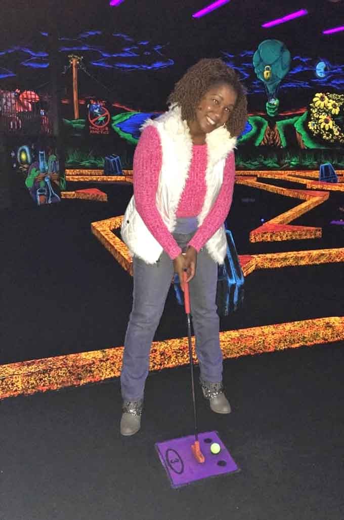 That smile says it all: this is what pure, unadulterated fun looks like when it's bathed in neon.