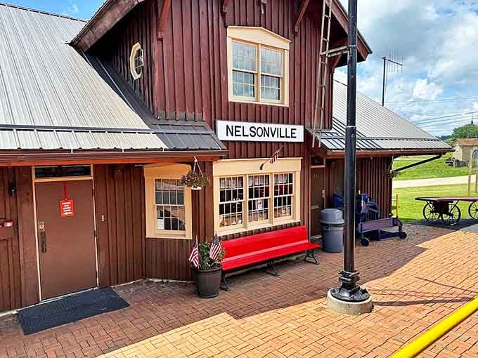 The Nelsonville station's rustic charm and welcoming red bench invite you to slow down before your journey even begins.