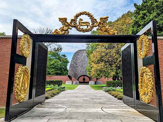 Those gilded bronze gates open like something from a dream where art meets spirituality meets architecture.