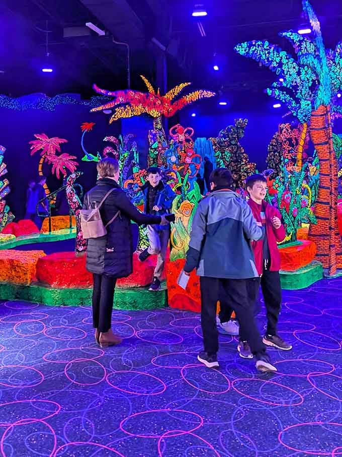 Nothing says family bonding quite like navigating fluorescent obstacles together in the dark.