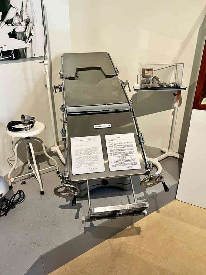 This medical table looks innocent enough until you read the placard and realize comfort wasn't part of the treatment plan.