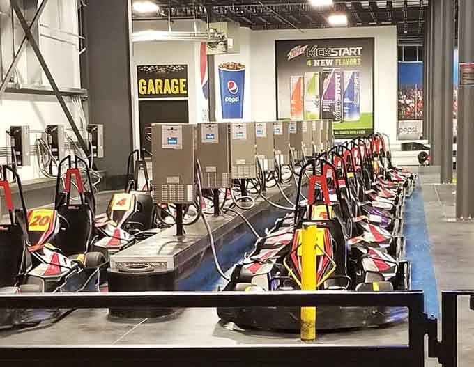 Rows of electric karts stand ready like eager racehorses, minus the hay and veterinary bills involved.