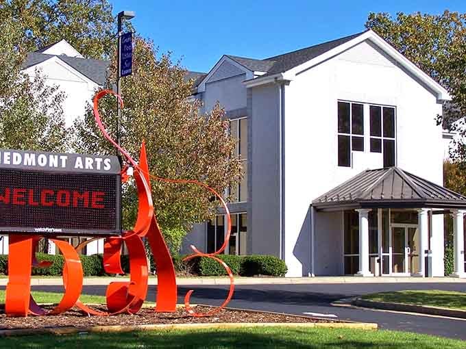 Piedmont Arts' striking red sculpture announces that creativity thrives here. Like a flame of imagination burning bright against the clean white building.