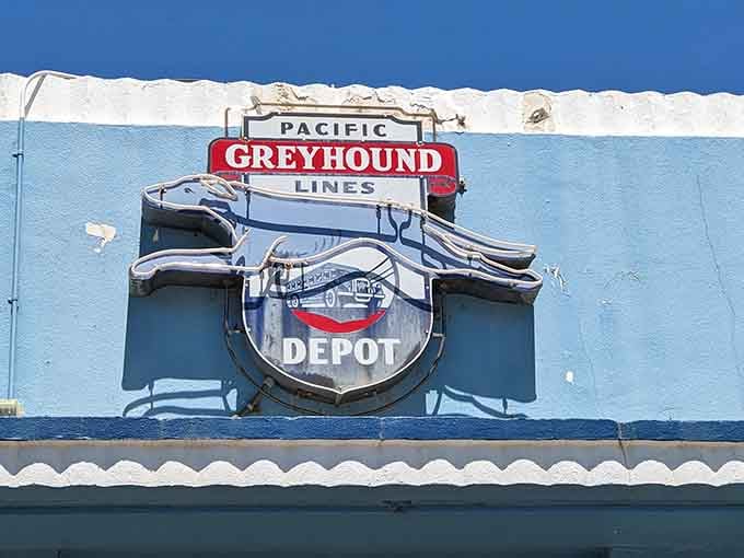That vintage Greyhound depot sign proves this town's been connecting people long before the internet existed.