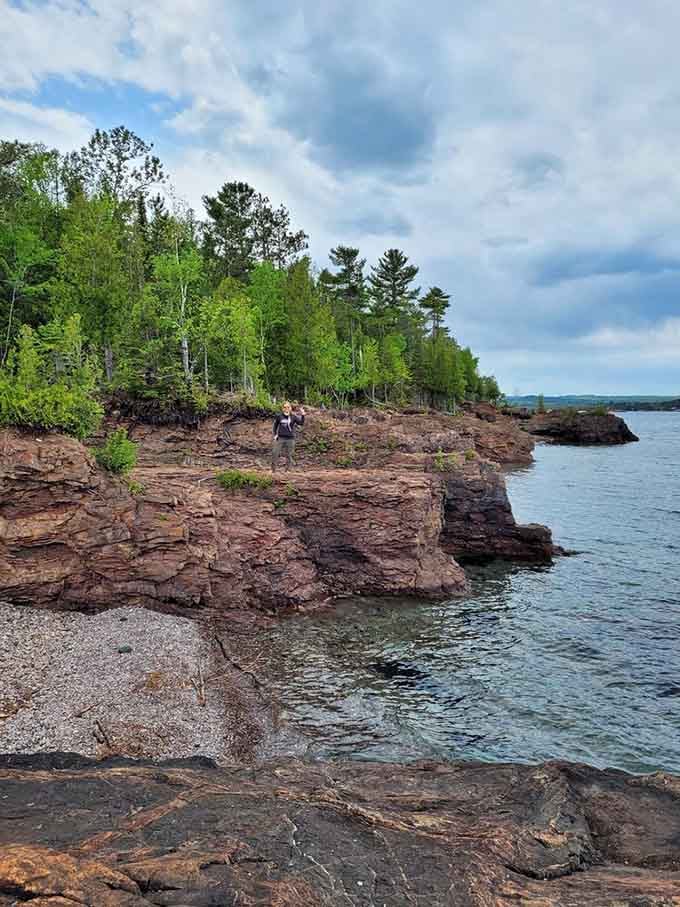 Ancient red cliffs meet impossibly blue water in a geological love story billions of years in the making.