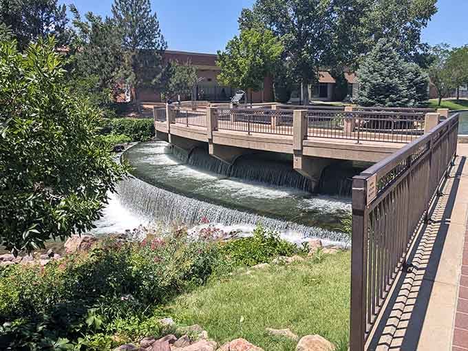Watch the water cascade over this charming weir, creating nature's own soundtrack for your afternoon stroll.
