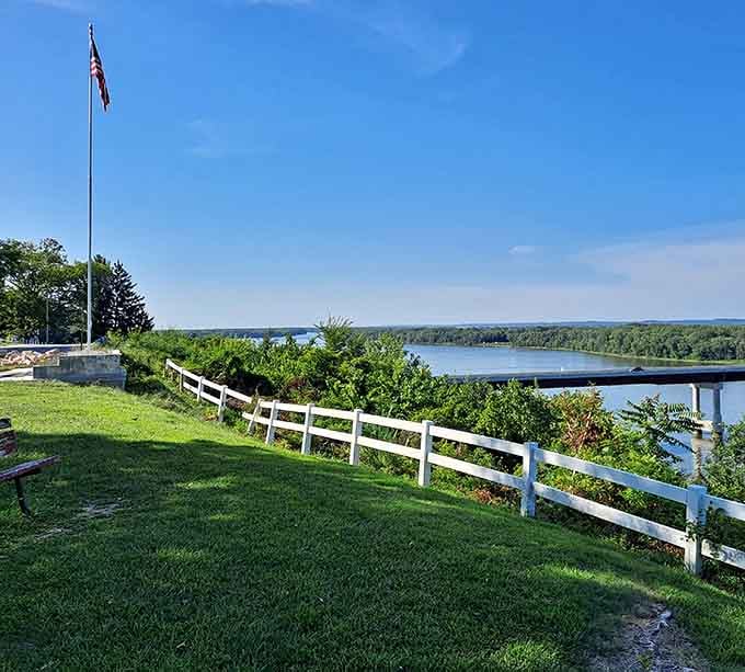 The mighty Mississippi unfurls beyond white picket fences, a living postcard that changes with each passing barge and season.