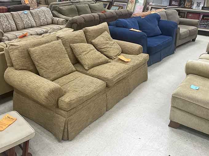The couch section stretches like a furniture showroom, proving one person's living room upgrade is another's perfect find.