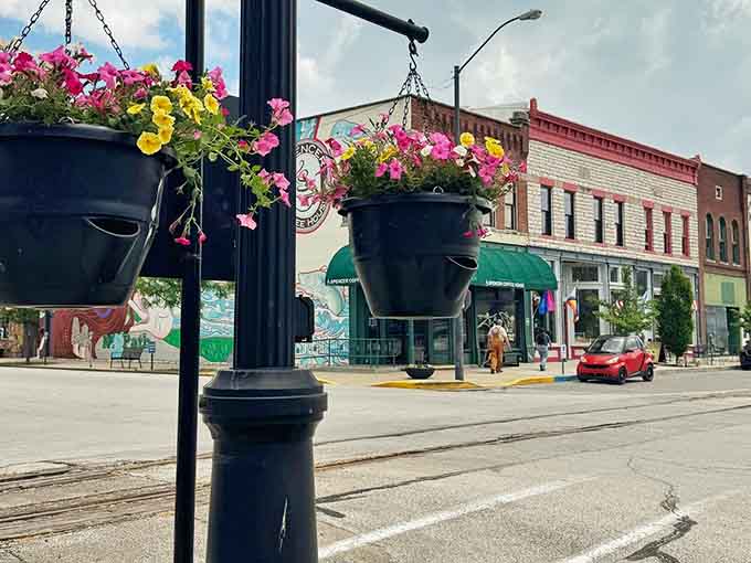 Hanging flower baskets transform ordinary street poles into bursts of color that make you slow down and smile.