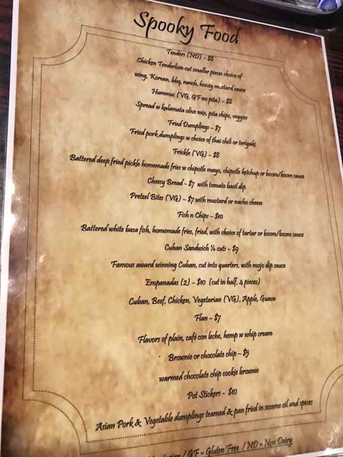 The menu promises "Spooky Food" but delivers seriously delicious comfort eats with theatrical flair throughout.