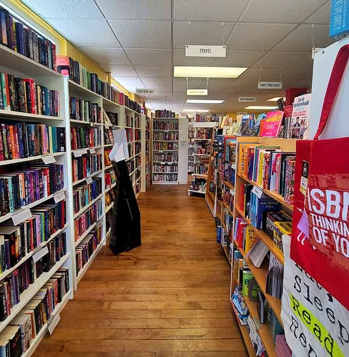 Floor-to-ceiling shelves stretching into the distance like a literary yellow brick road leading to reading paradise.