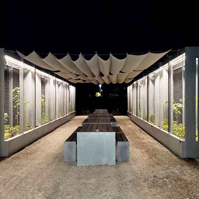 Evening gatherings under the pavilion prove that good design doesn't need to shout to be heard.