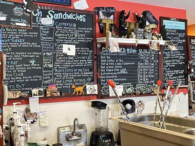 The chalkboard menu reads like a love letter to cats and coffee, with pun-filled sandwiches galore.