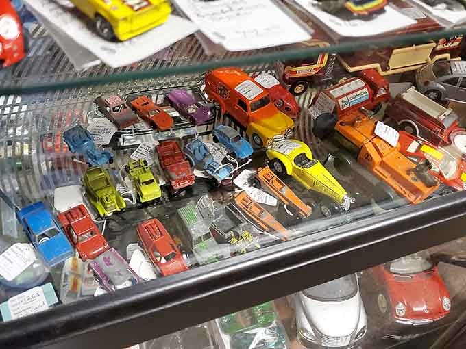 Vintage Hot Wheels and Matchbox cars lined up like a miniature traffic jam from your childhood dreams.