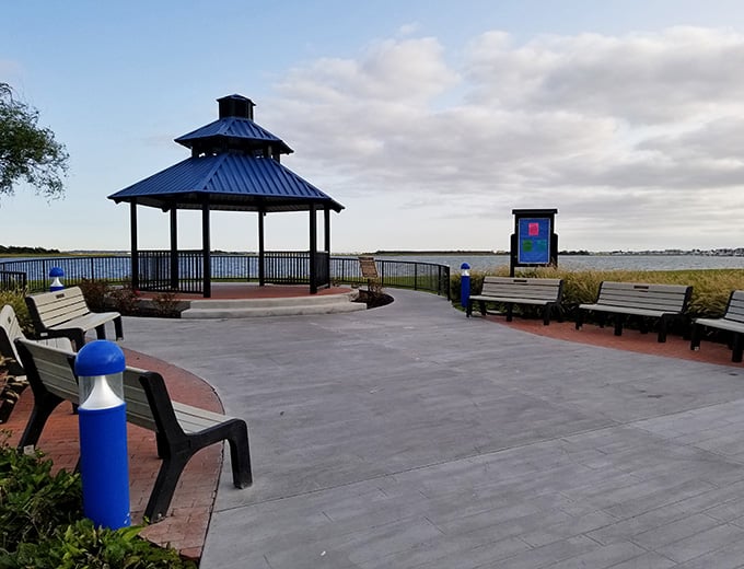 Sunset Lake Park offers peaceful waterfront views, perfect for contemplating why you ate that fourth slice of pizza.