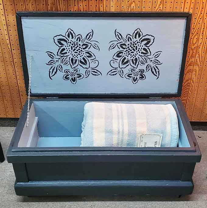 A wooden chest with delicate floral details that would make your grandmother smile with recognition and nostalgia.