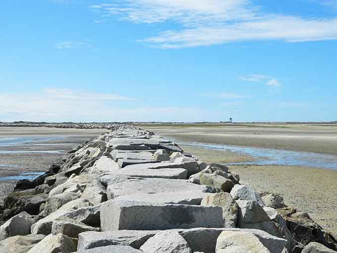 The famous breakwater stretches like a stone highway to adventure, challenging your balance and resolve.