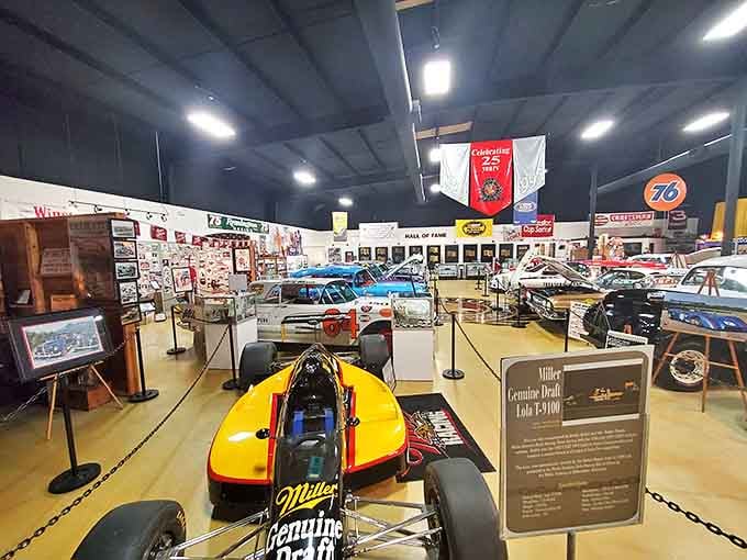 Racing history arranged like a mechanical art gallery, where every vehicle represents a chapter in America's love affair with speed.