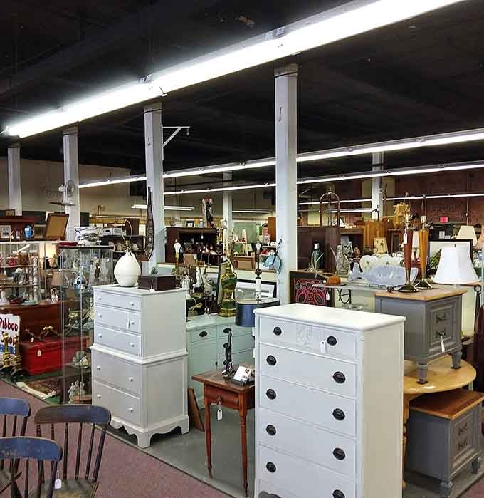 White dressers stand like elegant ghosts of households past, each drawer potentially hiding someone's forgotten treasures or grandmother's best linens.
