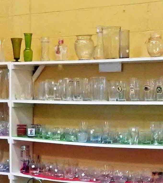 Glassware heaven! From emerald green vases to ruby tumblers, these shelves offer the perfect vessels for your next dinner party or impromptu cocktail hour.