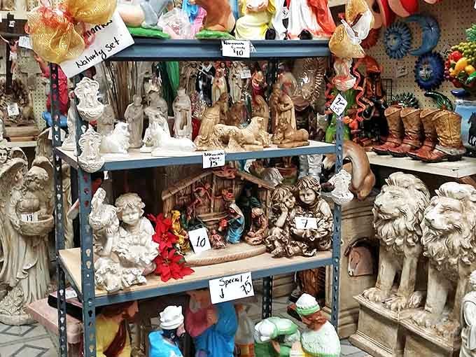 Religious figurines and garden statuary stand in silent formation. From cherubic angels to regal lions, someone's perfect porch guardian awaits discovery.