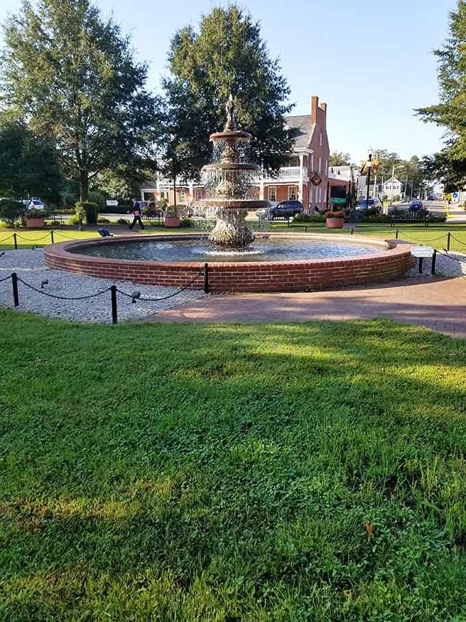 The town circle's fountain creates a peaceful oasis where locals gather, gossip, and occasionally debate whether water features or coffee are more effective at bringing people together.