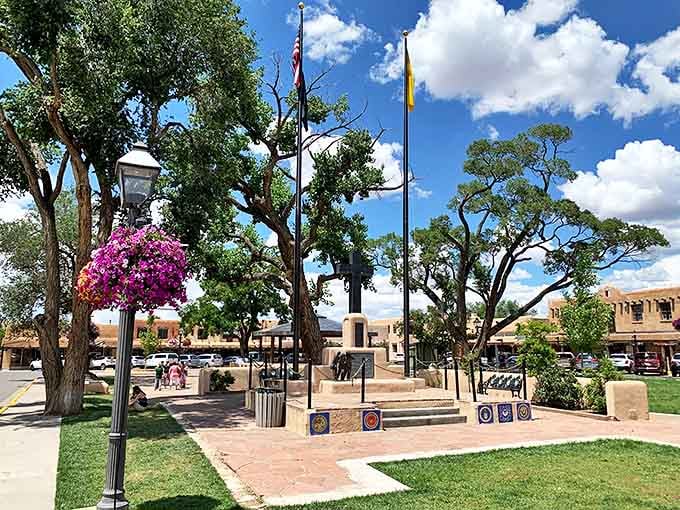 Taos Plaza's memorial park offers a shady respite where hanging flower baskets compete with mountain views for your attention. Nature wins, but narrowly.
