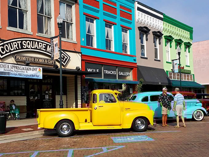 Classic cars meet classic architecture on Abbeville's brick-paved streets. That yellow pickup looks like it's auditioning for a nostalgic Americana calendar.