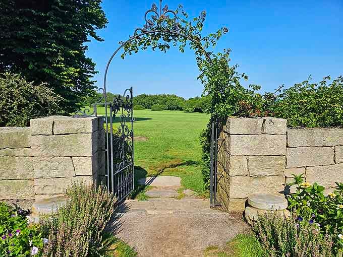 Every great garden needs a dramatic entrance. This stone gateway practically whispers, "Come in, the real world can wait a few hours."