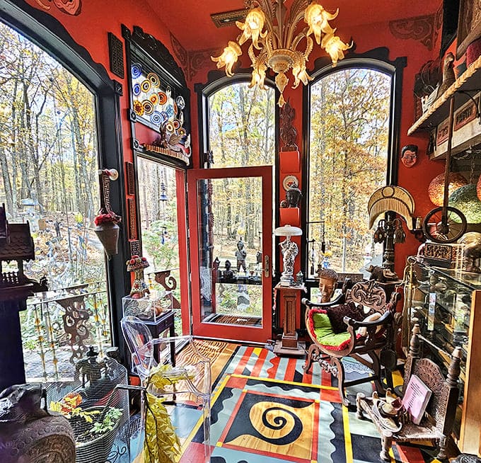 Inside, every surface tells a story. This vibrant room with its painted floor and eclectic furnishings redefines the concept of "open concept."