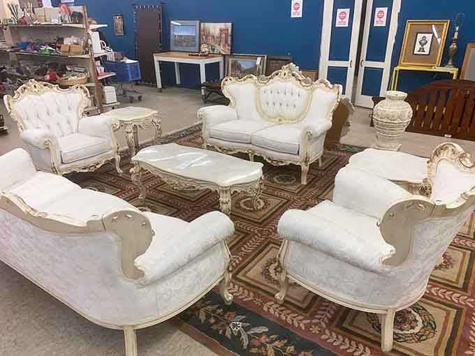 Versailles called&mdash;they want their furniture back. This regal white and gold living room set awaits its next royal family.